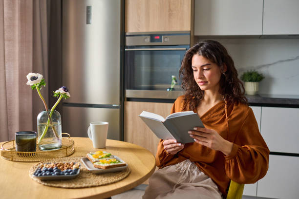Free Stock Photo of Woman Reading a Book in a Kitchen | Download Free ...