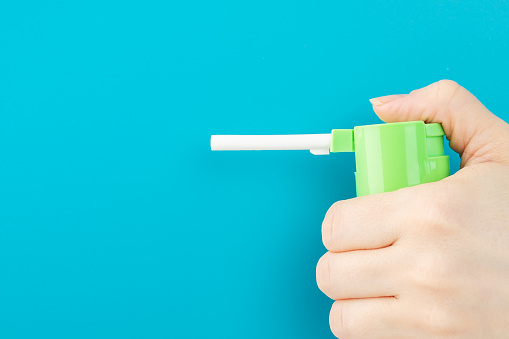 Spray Aerosol For The Treatment Of A Sore Throat Sore Throat On A Blue