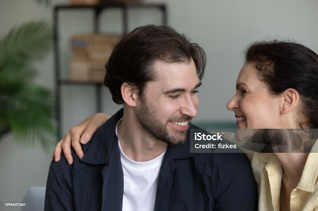 Happy Mature Mother Hugging Son With Love Gratitude Affection Stock