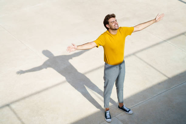 Free Stock Photo of A person standing on a surface with their arms ...