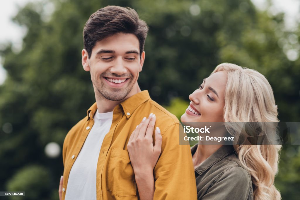 Portrait Of Attractive Tender Gentle Cheerful Amorous Couple Cuddling