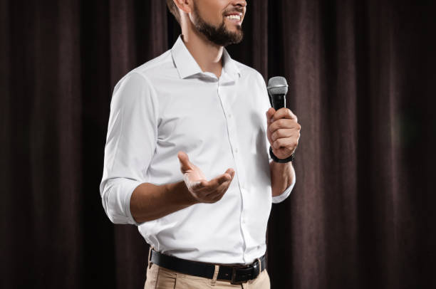 Free Stock Photo of Man Standing on Top of Stage Holding Microphone ...