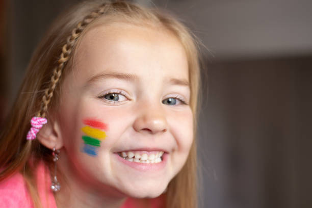 Free Stock Photo of Young Girl With Rainbow Face Paint | Download Free ...