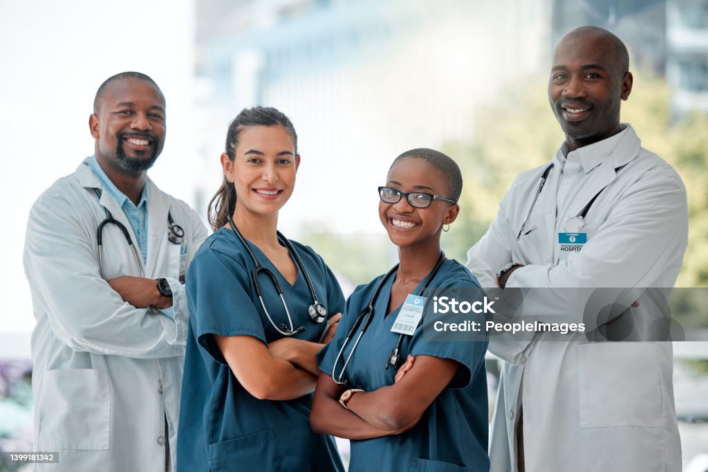 Group Of Happy Diverse Doctors And Nurses Standing In A Line With Their ... Group Of Happy Diverse Doctors And Nurses Standing In A Line With Their ...