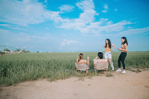 Asian Chinese Lesbian Couple And Friends Enjoying Paddy Field Scenery