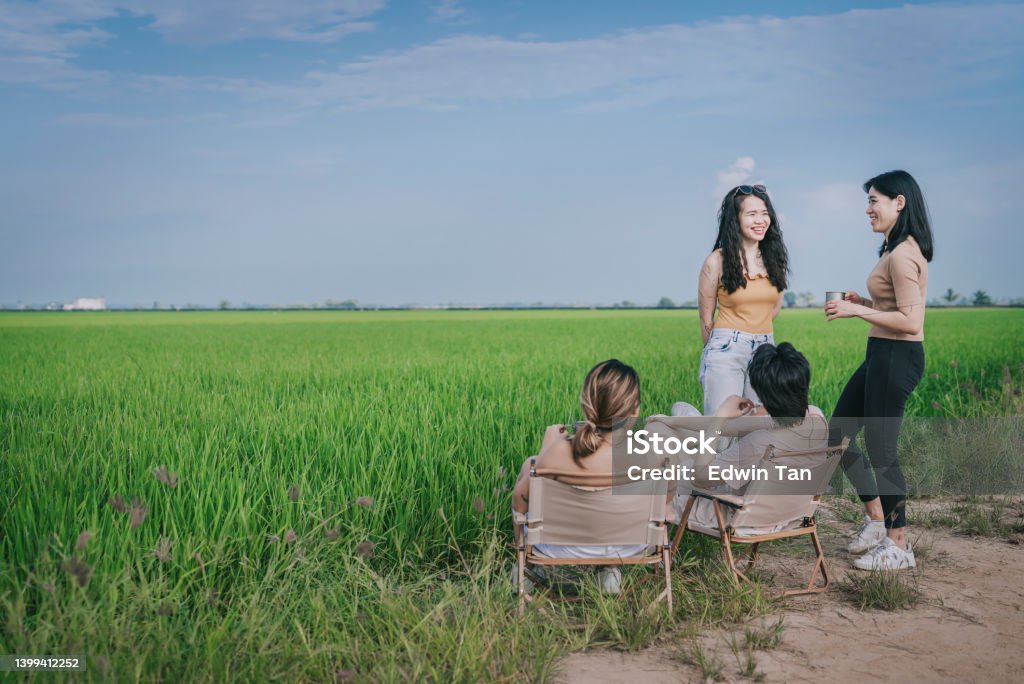 Asian Chinese Lesbian Couple And Friends Enjoying Paddy Field Scenery