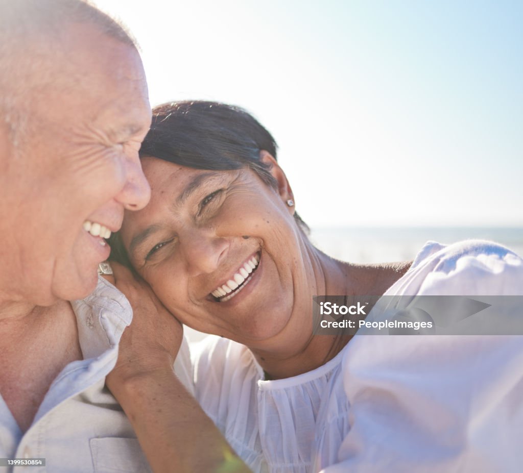 Affectionate Mature Mixed Race Couple Sharing An Intimate Moment On The