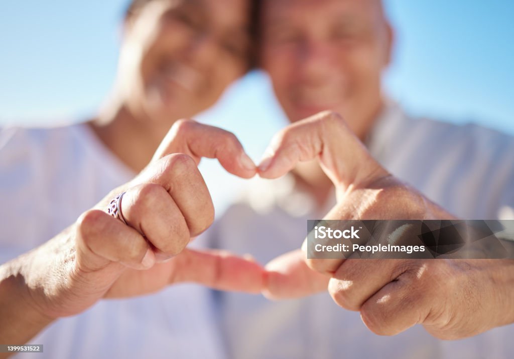 Affectionate Mature Mixed Race Couple Sharing An Intimate Moment On The
