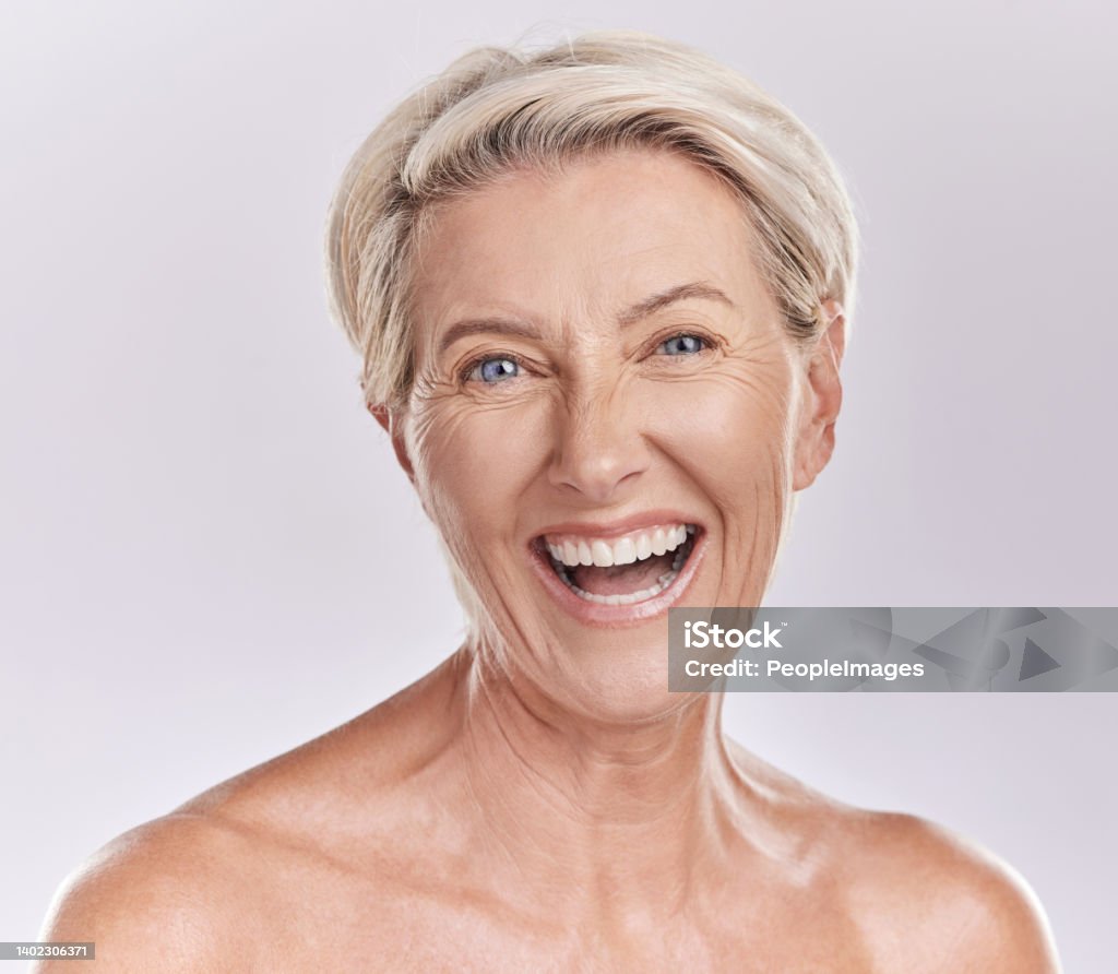 Portrait Of A Happy Smiling Mature Caucasian Woman Looking Positive And