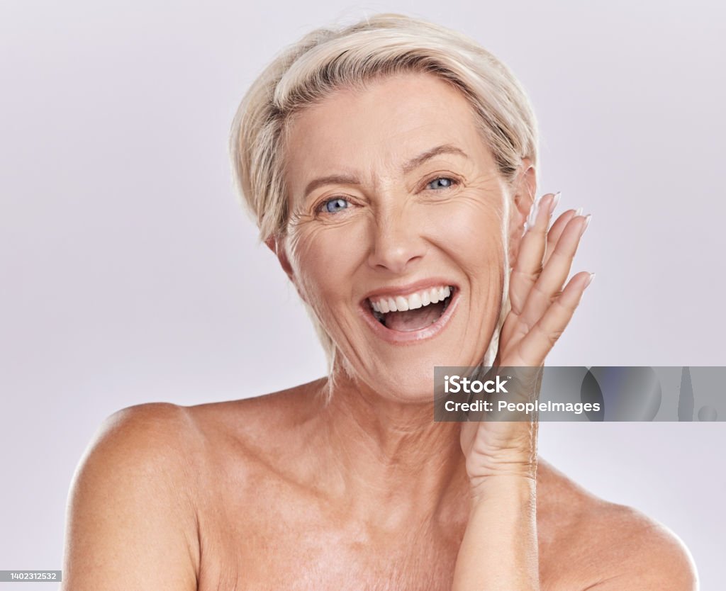 Portrait Of A Happy Smiling Mature Caucasian Woman Looking Positive And