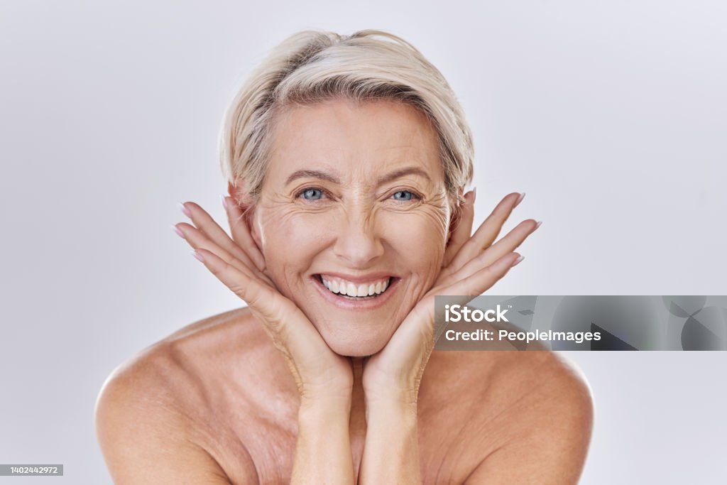 Portrait Of A Happy Smiling Mature Caucasian Woman Looking Positive And