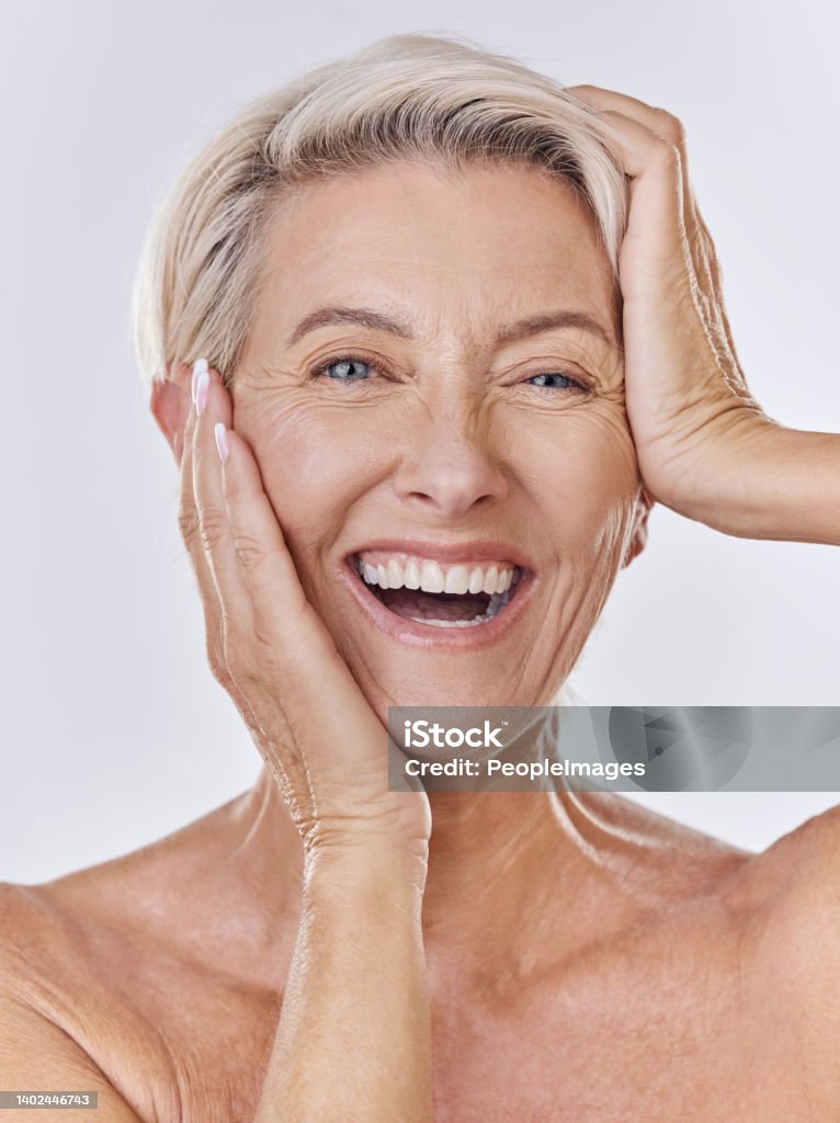 Portrait Of A Happy Smiling Mature Caucasian Woman Looking Positive And