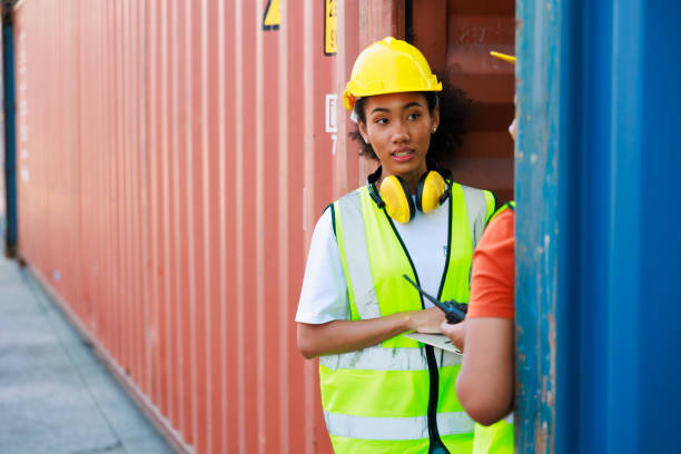 Free Stock Photo of Two Black female dock workers relax and talk ...