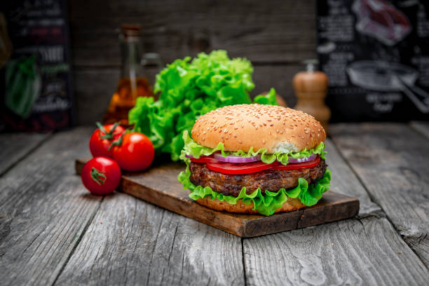 Free Stock Photo of Hamburger on Wooden Cutting Board | Download Free ...