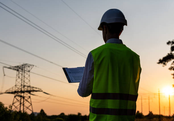 Free Stock Photo of Man Standing in Field Under Power Lines | Download ...