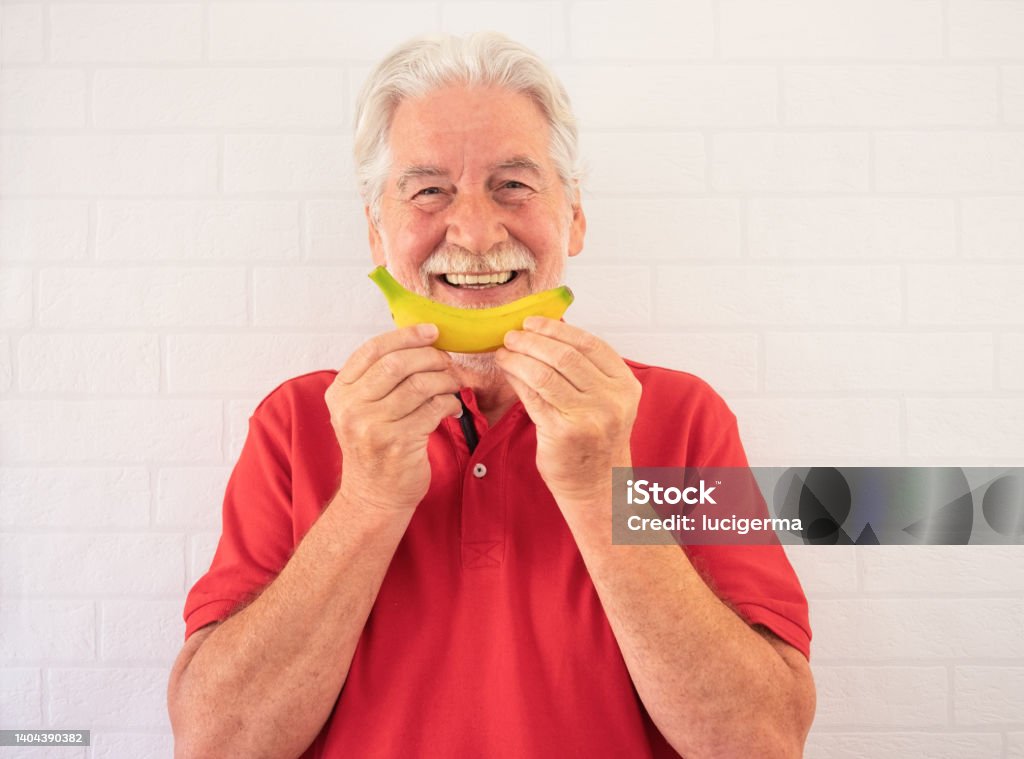 Cheerful Senior Man With A White Beard And In Red Polo Shirt Isolated