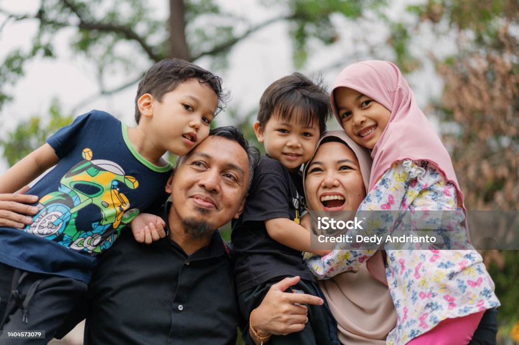 Malaysian Muslim Family Having Fun Portrait At Playgroud Stock Photo ... Malaysian Muslim Family Having Fun Portrait At Playgroud Stock Photo ...