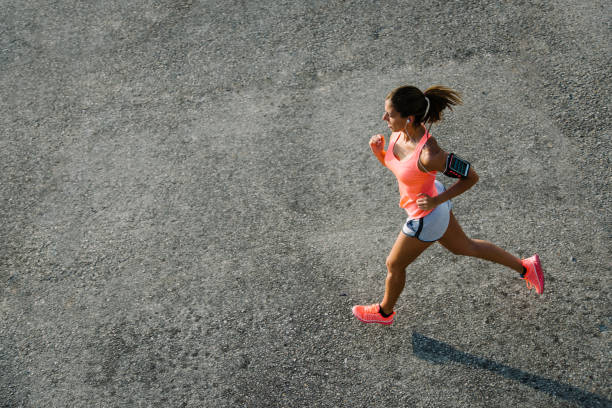 Free Stock Photo of Woman Running Down a Street in a Race | Download ...