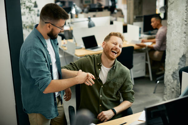 Free Stock Photo of Business people sharing a laugh in office ...