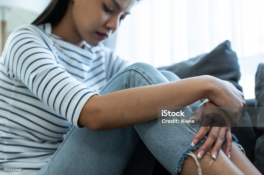 Asian Beautiful Upset Depressed Girl Sitting Alone On Bed In Bedroom