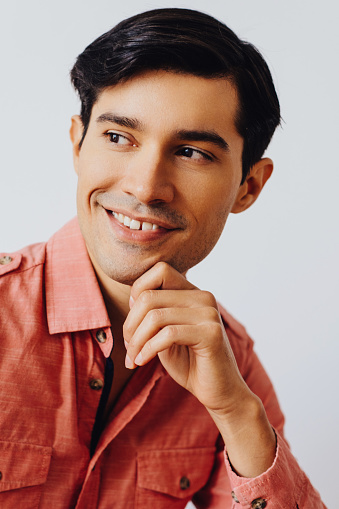 Headshot Smiling Thoughtful Handsome Young Adult Latino Man With Hand ... Headshot Smiling Thoughtful Handsome Young Adult Latino Man With Hand ...