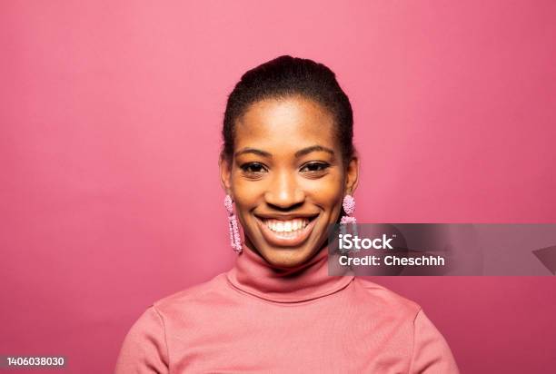 Portrait Of Young Beautiful Smiling Dark Skinned Woman Isolated Over