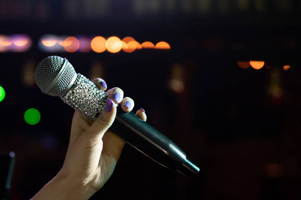 Free Stock Photo of Performer holding microphone on stage | Download ...