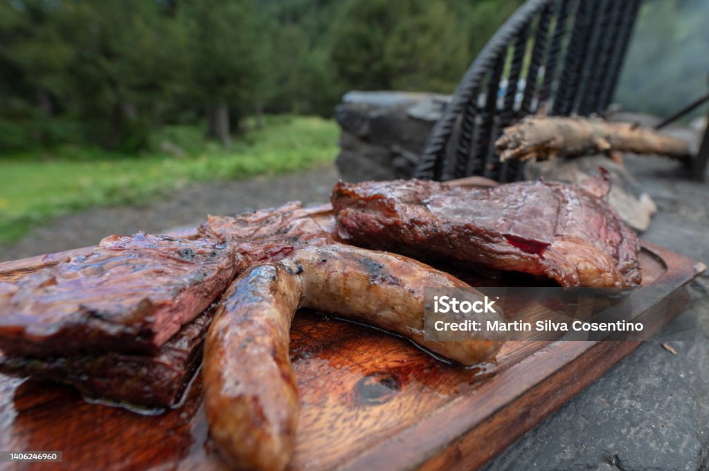 Typical Uruguayan And Argentine Asado Cooked On Fire Entrana And Vacio