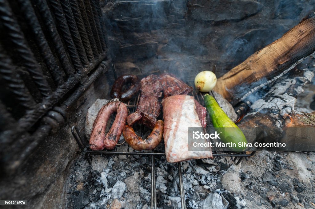 Typical Uruguayan And Argentine Asado Cooked On Fire Entrana And Vacio