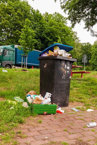 Overflowing Trash Can In The Parking Area Road Rest Area Near Highway