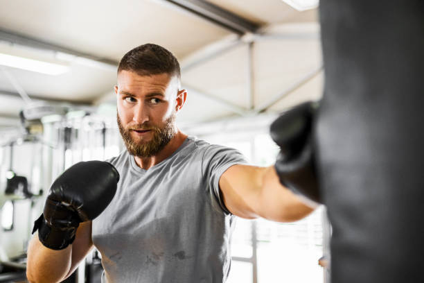 Free Stock Photo of Muscular man boxing training exercise at a fitness ...