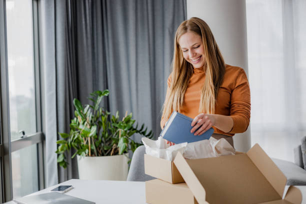 Free Stock Photo of Lifestyle. Woman opening a box at her desk ...