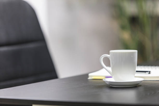 Free Stock Photo of Close up of a coffee mug on the table in a work ...