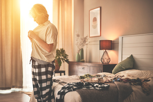A Tired Unhappy Woman Getting Ready Dressing For Work A Woman Feeling ... A Tired Unhappy Woman Getting Ready Dressing For Work A Woman Feeling ...