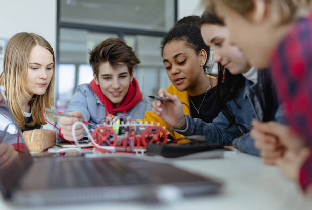 Free Stock Photo of Students learning in a robotics lab, working in ...