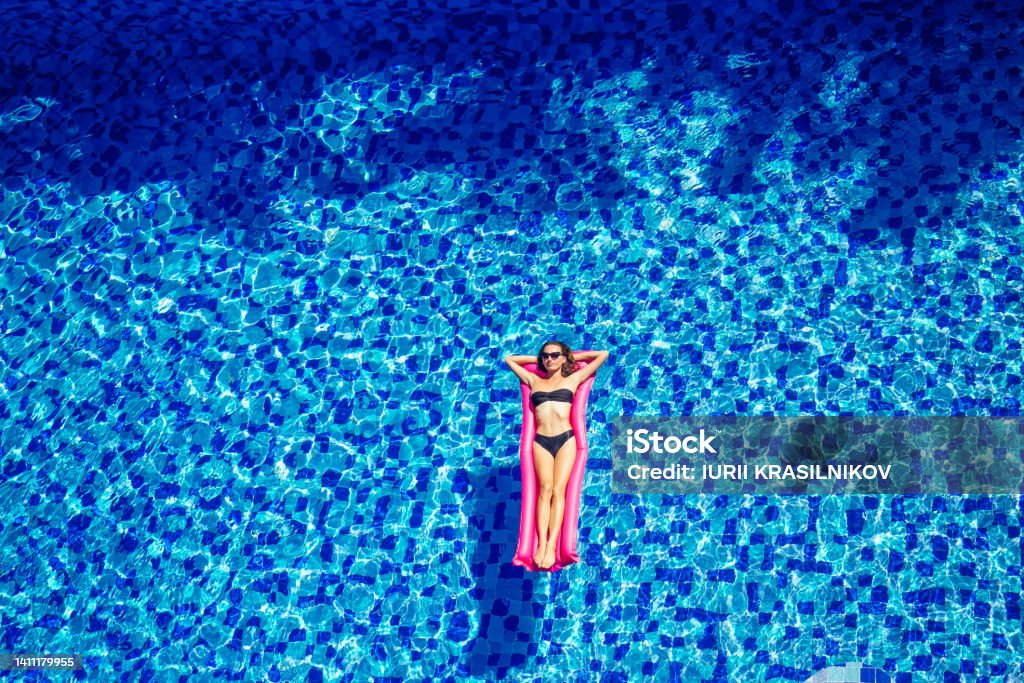 Copy Space Spf And Sunscreen Beautiful Brunette Girl Floating In The