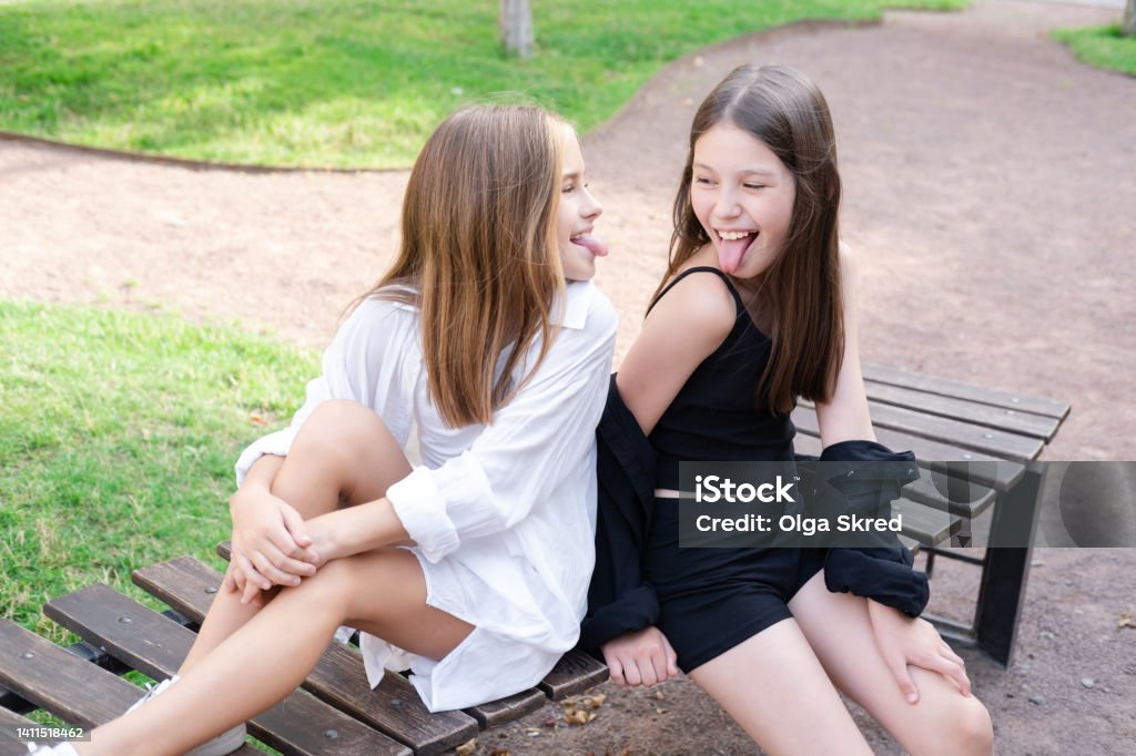 Fraternal Twins Sisters Blonde And Brunette Teen Girls In Fashionable