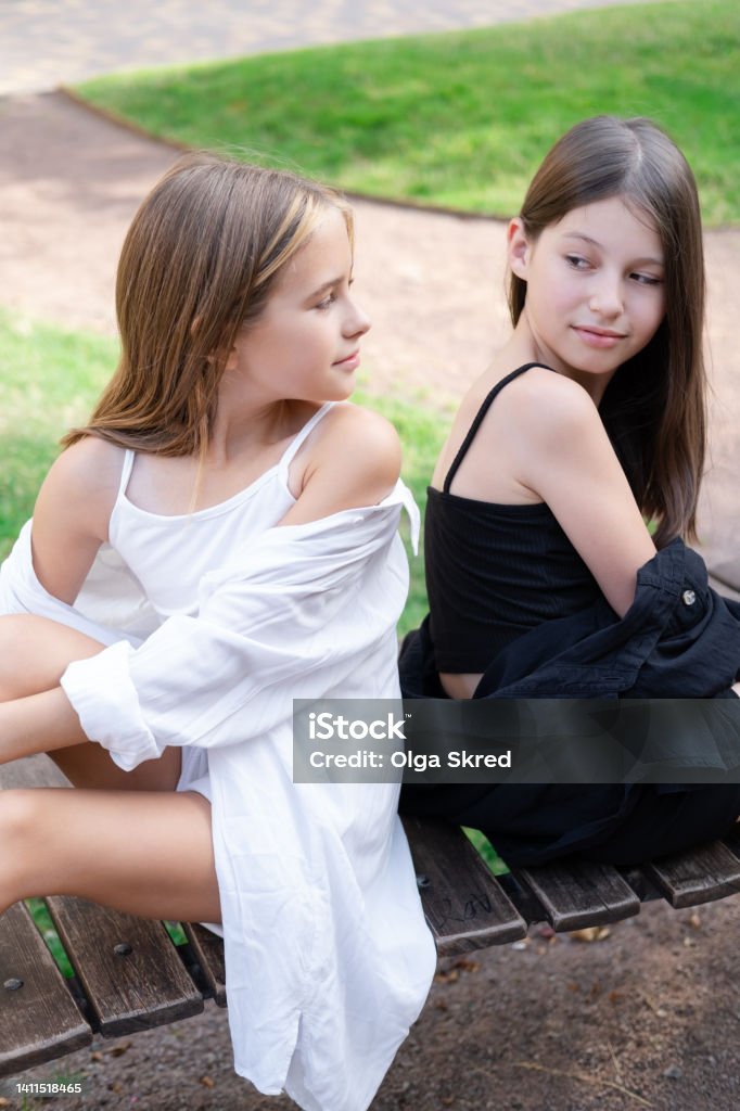 Fraternal Twins Sisters Blonde And Brunette Teen Girls In Fashionable