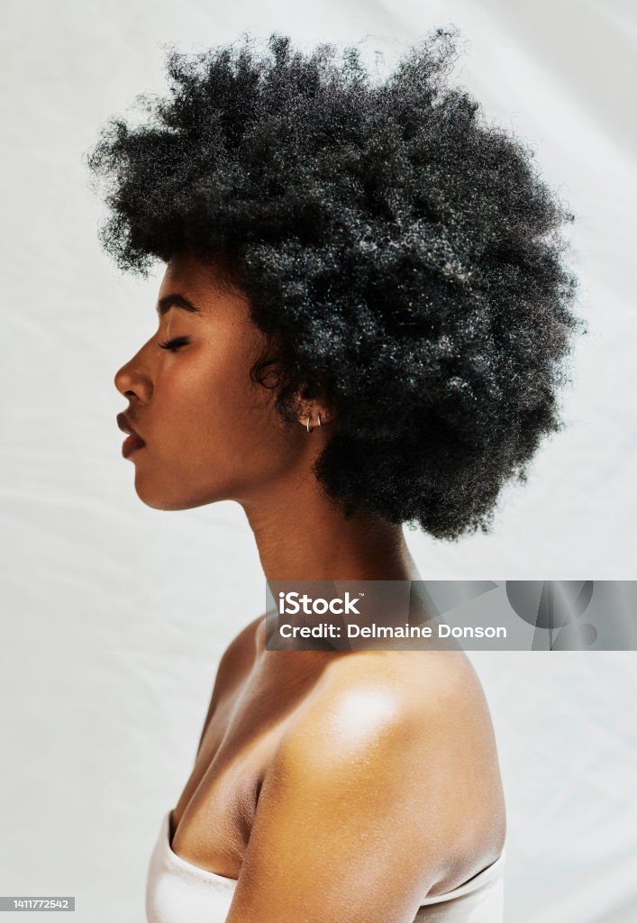 Side Profile Of An African Woman With A Afro Isolated Against A White