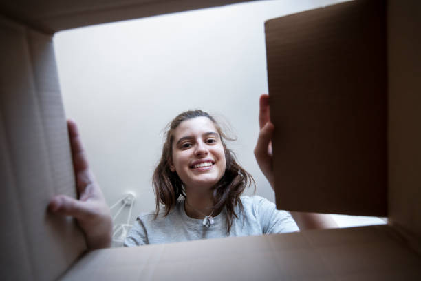 Free Stock Photo of Lifestyle. Woman delighted after opening a box ...
