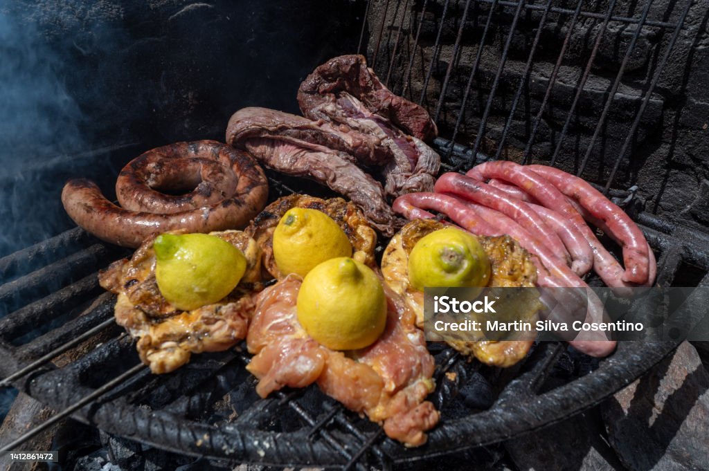 Typical Uruguayan And Argentine Asado Cooked On Fire Entrana And Vacio