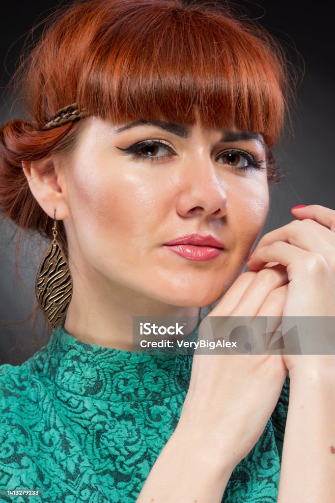 Image Of Pretty Redhead Young Lady In Green Dress Standing With Arms
