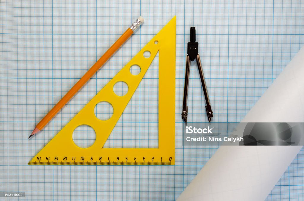 Set Of Tools For Drawing On An Graph Paper Ruler Compass Pencil On Sheet Of Paper For Drawing