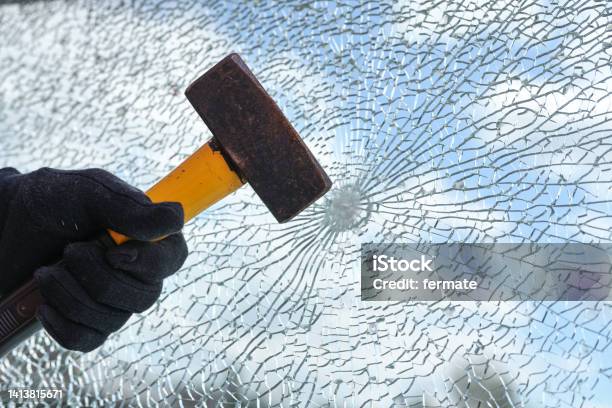 Mans Hand Is Hitting A Window From Safety Glass With A Heavy Hammer Vandalism And Burglary