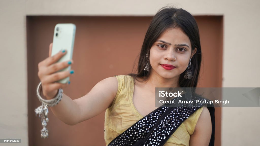 Beautiful Indian Girl Taking Selfie On Her Mobile Phone Outdoor