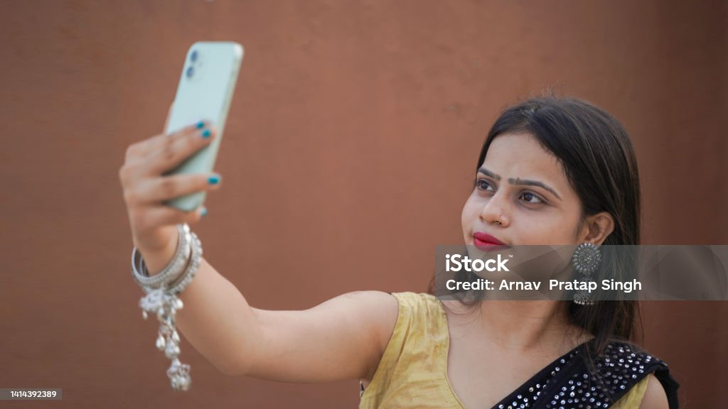 Beautiful Indian Girl Taking Selfie On Her Mobile Phone Outdoor Cheerful Asian Woman In
