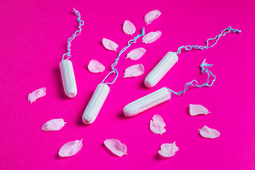 Female Tampons With With Cherry Petals On A Pink Background Hygienic ... Female Tampons With With Cherry Petals On A Pink Background Hygienic ...