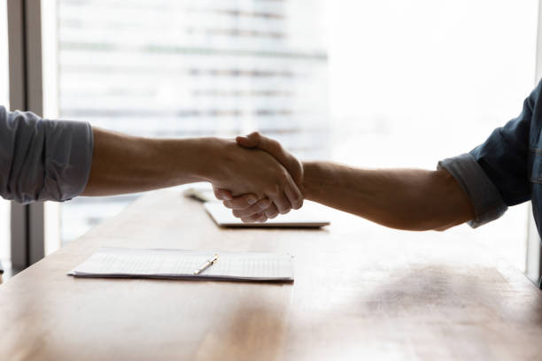 Free Stock Photo of Two People Shaking Hands Over a Table | Download ...