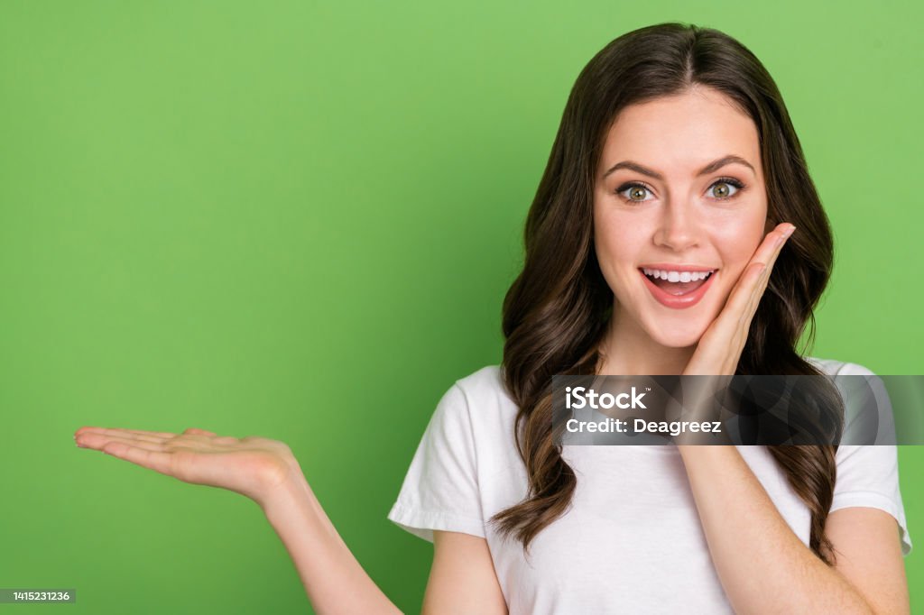 Photo Of Sweet Excited Young Lady Wear White Tshirt Arm Cheek Holding