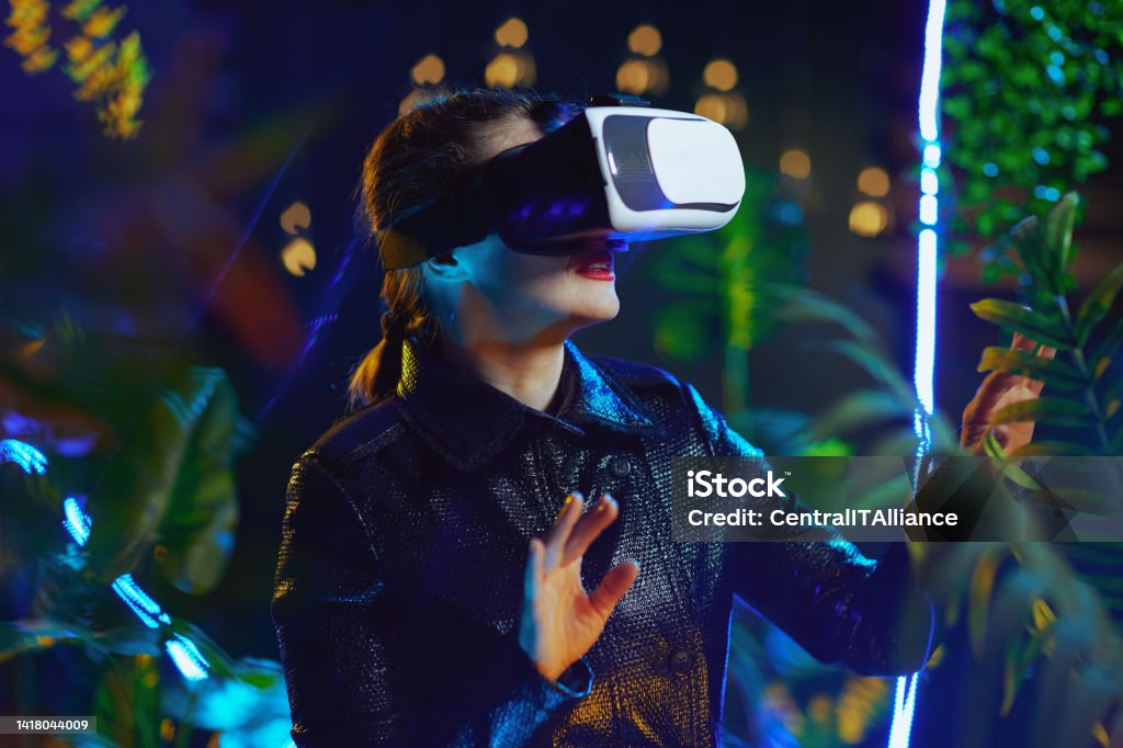 Modern Woman In Metaverse In Vr Goggles Exploring Stock Photo ... Modern Woman In Metaverse In Vr Goggles Exploring Stock Photo ...